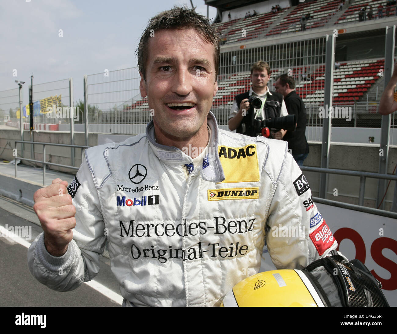 German Bernd Schneider jubilates after taking first place of the ...