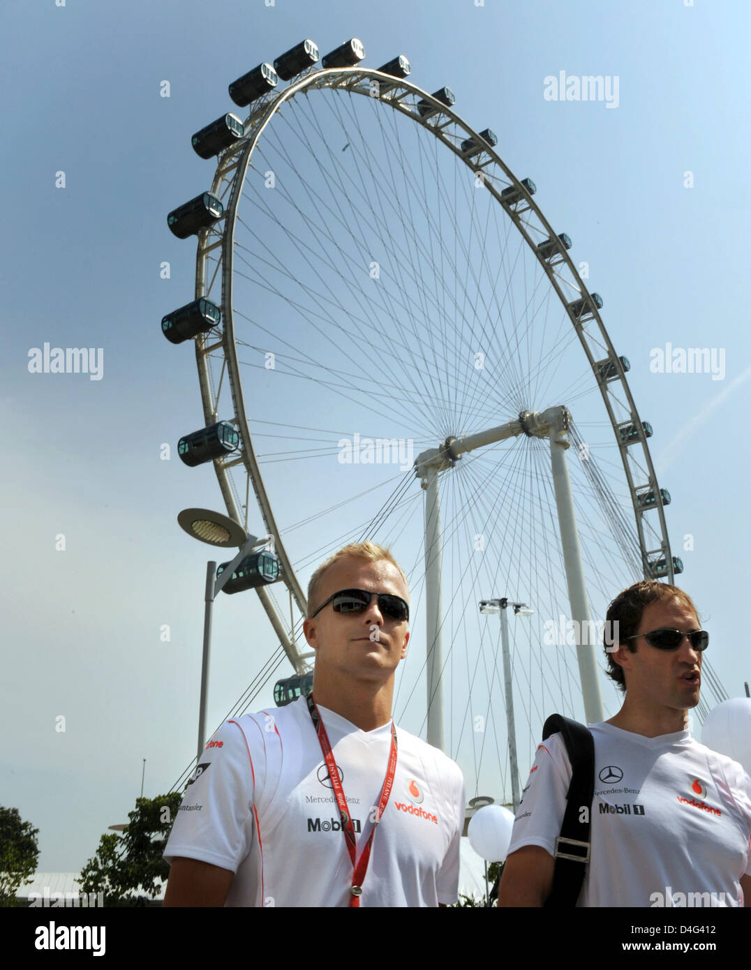 Finnish Formula One driver Heikki Kovalainen (L) of McLaren Mercedes ...