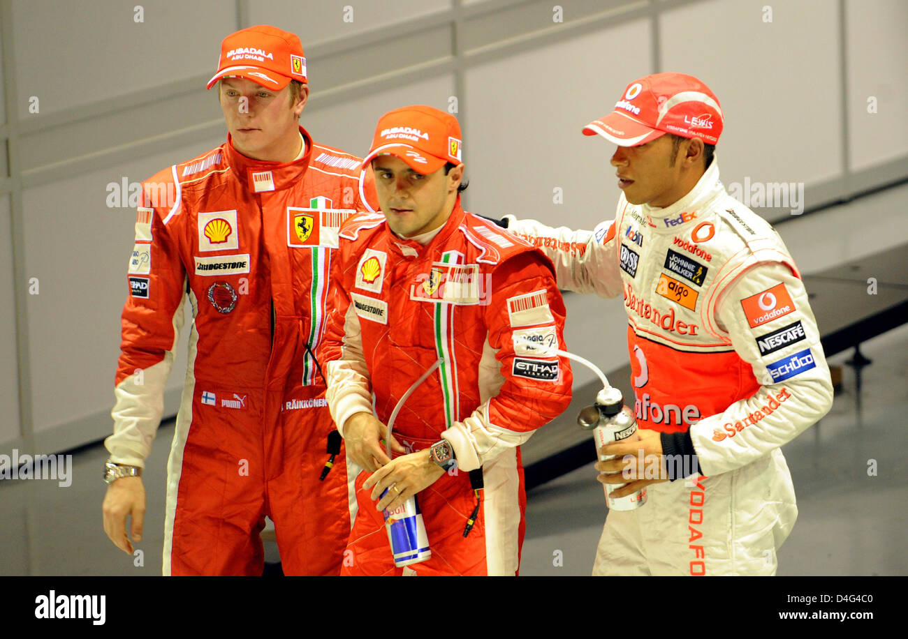 Brazilian Formula One driver Felipe Massa (C) of Ferrari reacts after ...