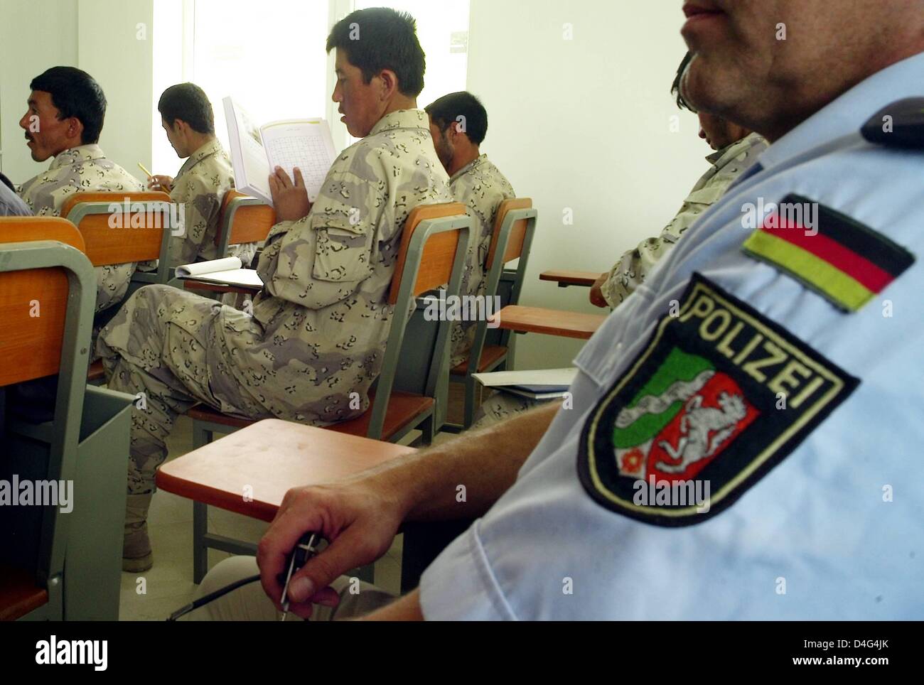 Afghan boarder policemen learn how to read and write in Masar-i-Scharif ...