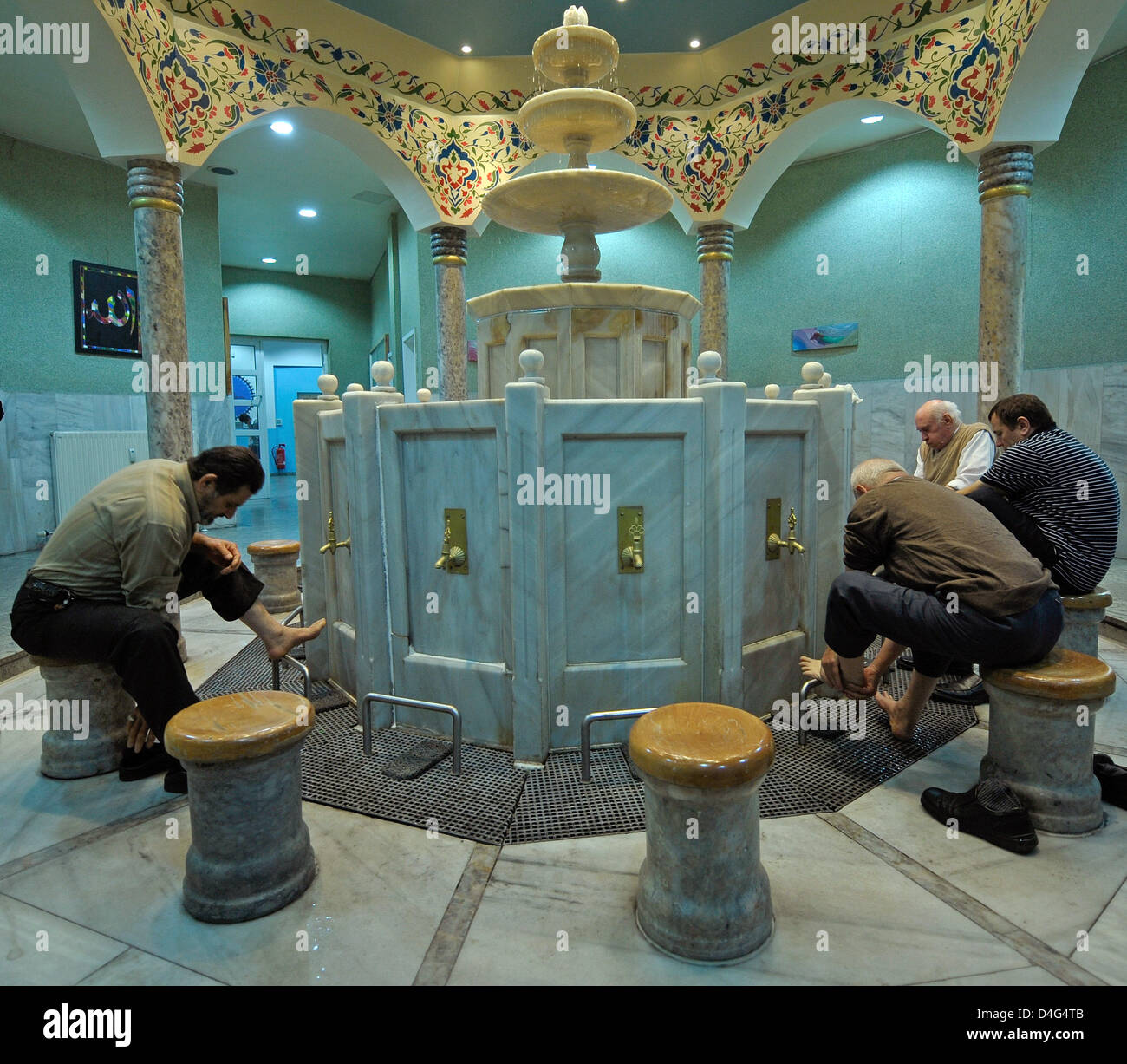 Muslims pictured in a washing room of Yavuz Sultan Selim mosque in ...