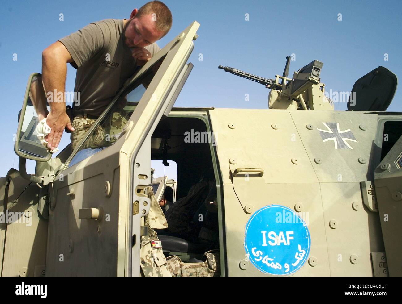 A German Bundeswehr soldier of the Quick Reaction Force (QRF) polishes ...