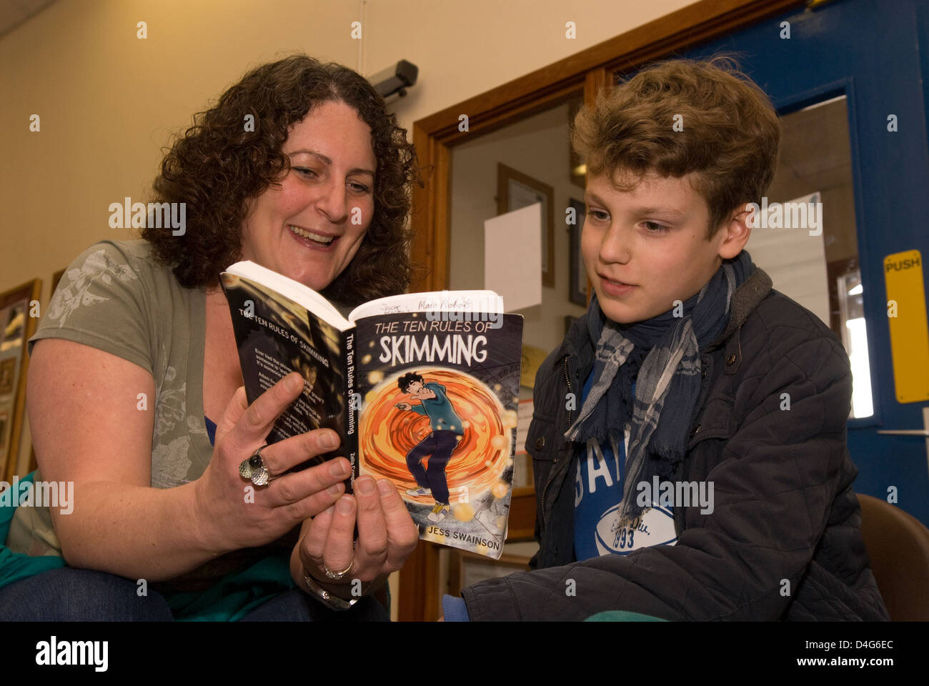 Two Boys Holding Books High Resolution Stock Photography and Images - Alamy
