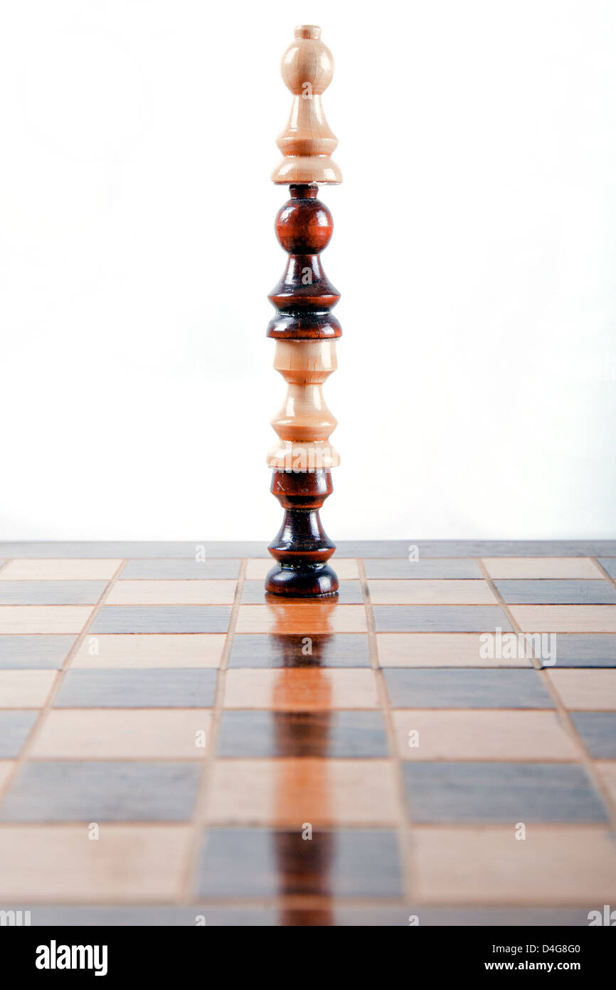 tower made out of several chess pieces stacked on top of each other ...