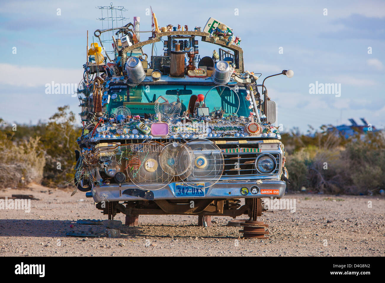 An old pickup truck is decorated as a piece of folk art in the ...