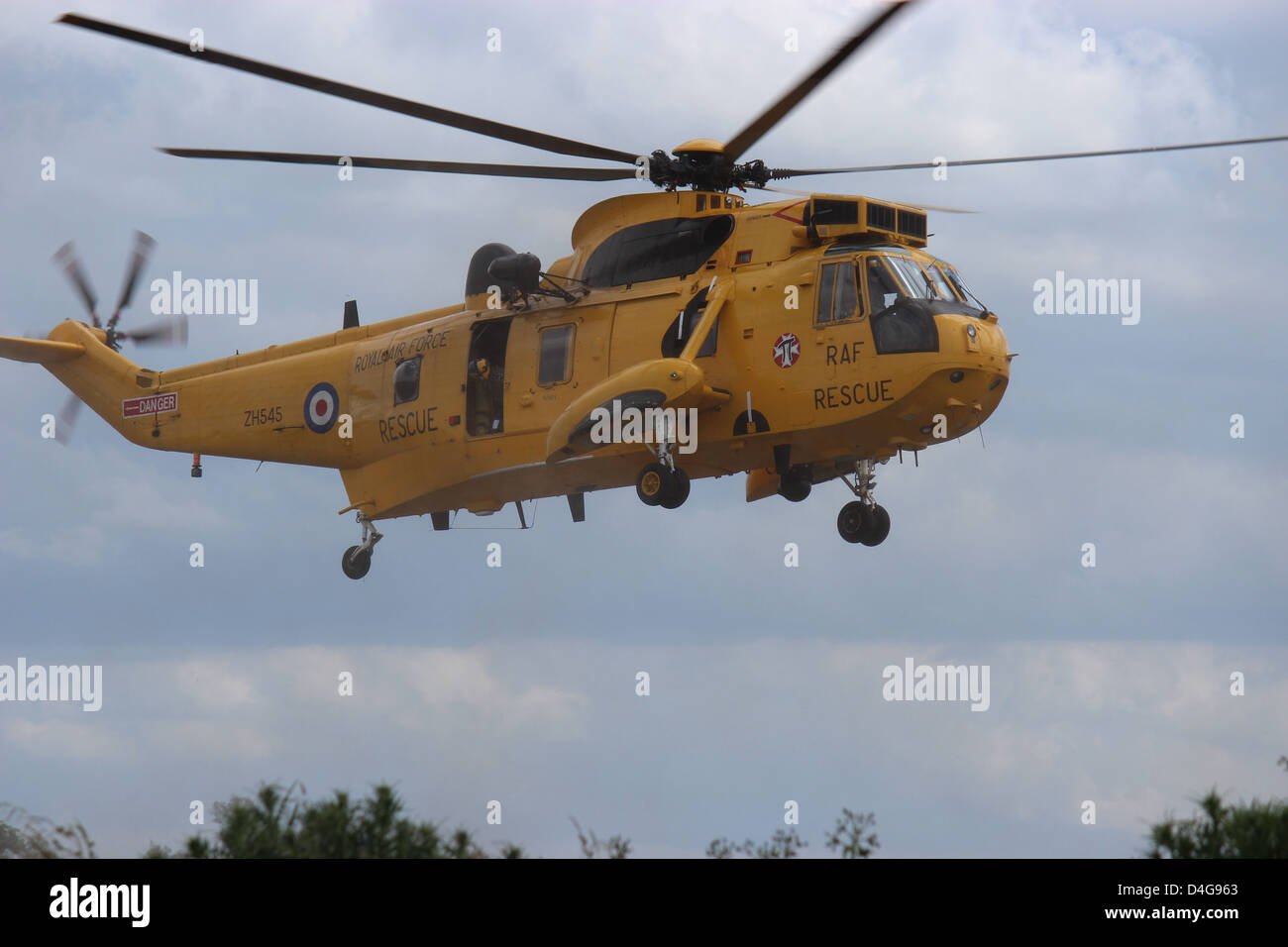 Wasteland Sea King SAR landing, low flyby Stock Photo - Alamy