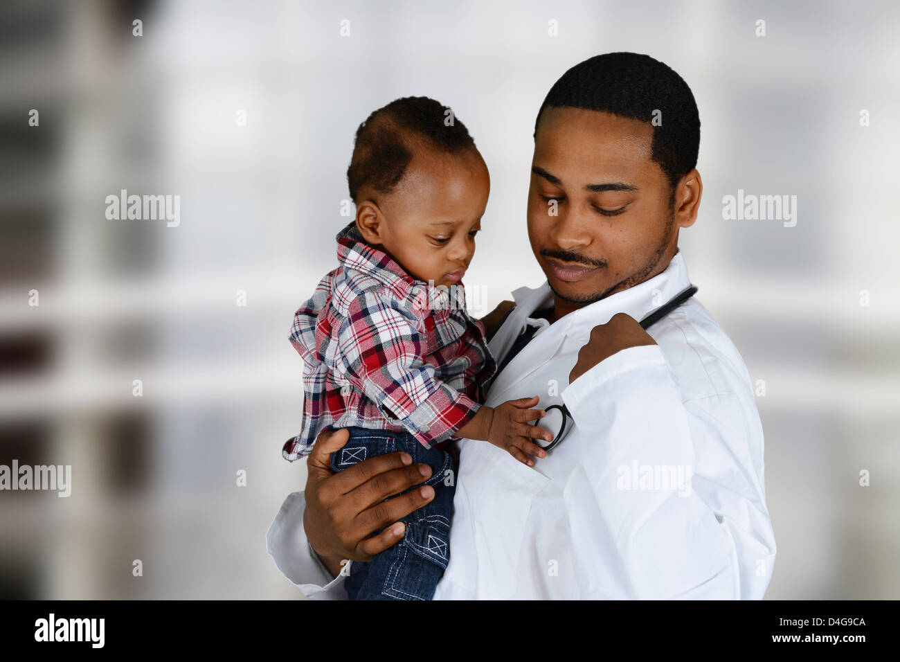 Minority male doctor working in a hospital Stock Photo - Alamy