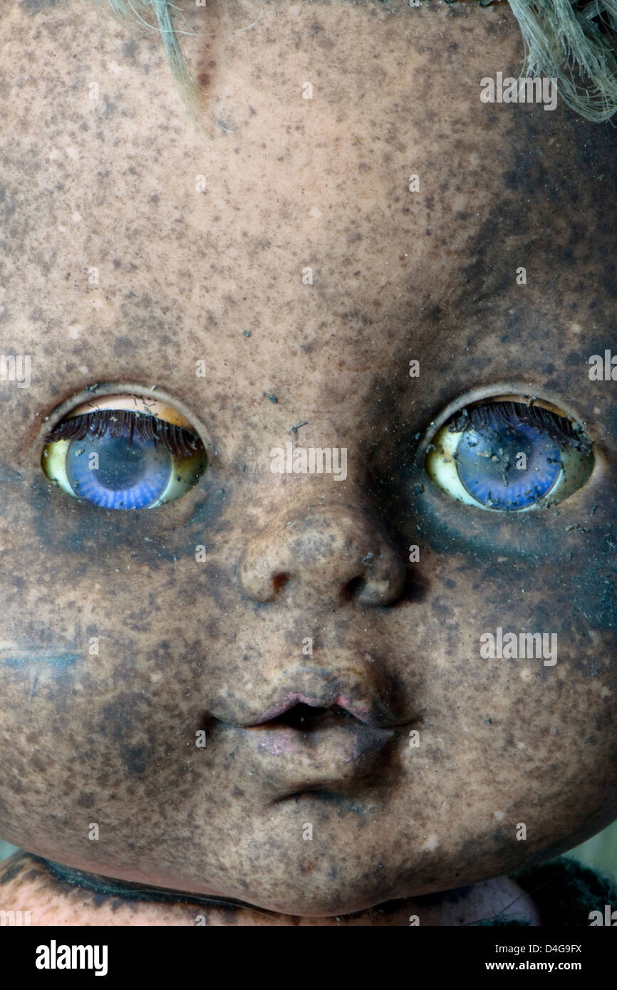 A close up of a decayed dolls head and face Stock Photo - Alamy