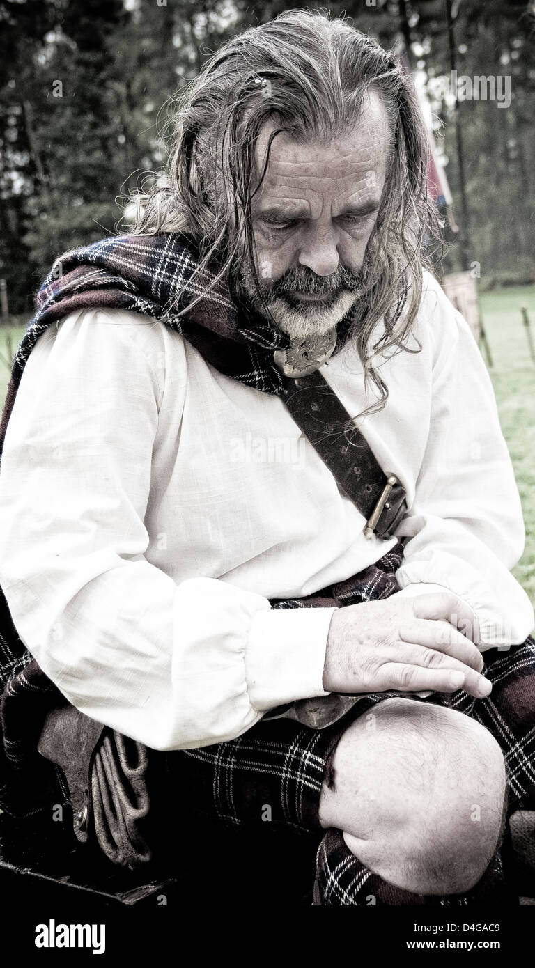 Highland clan member reenacting village life Stock Photo - Alamy