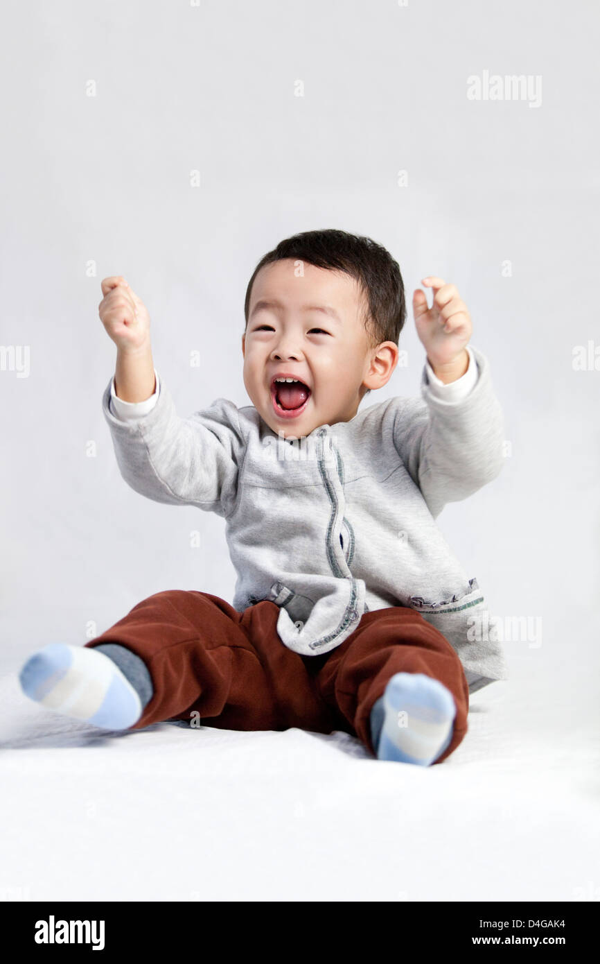 Cute little boy shouting with excitement Stock Photo - Alamy