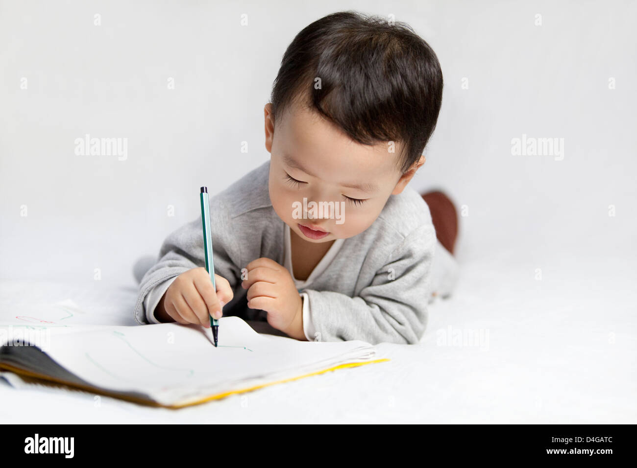 Children writing early childhood development hi-res stock photography ...