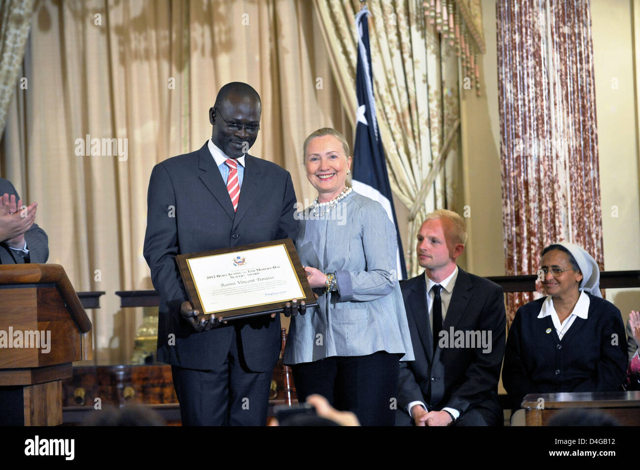 Secretary Clinton With TIP Hero Raimi Vincent Paraiso Stock Photo - Alamy
