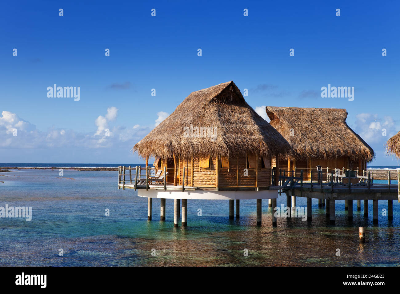 Typical Polynesian landscape -small houses on water Stock Photo - Alamy