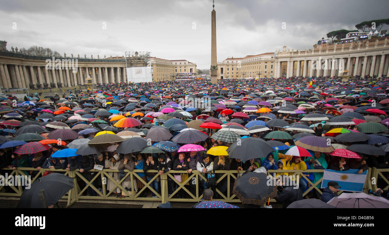 Tired believers wait at St. Peter's Square for smoke to rise from the ...
