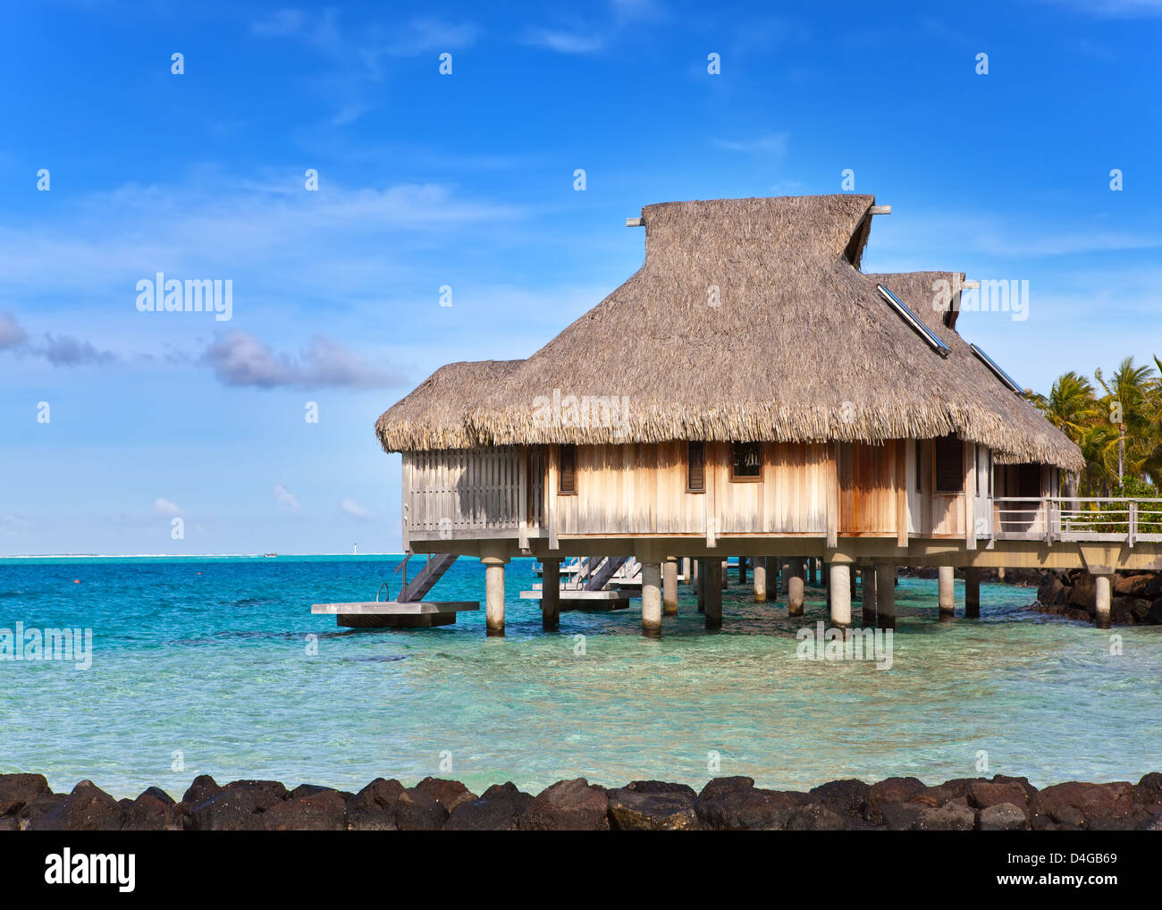 Typical Polynesian landscape -small houses on water Stock Photo - Alamy