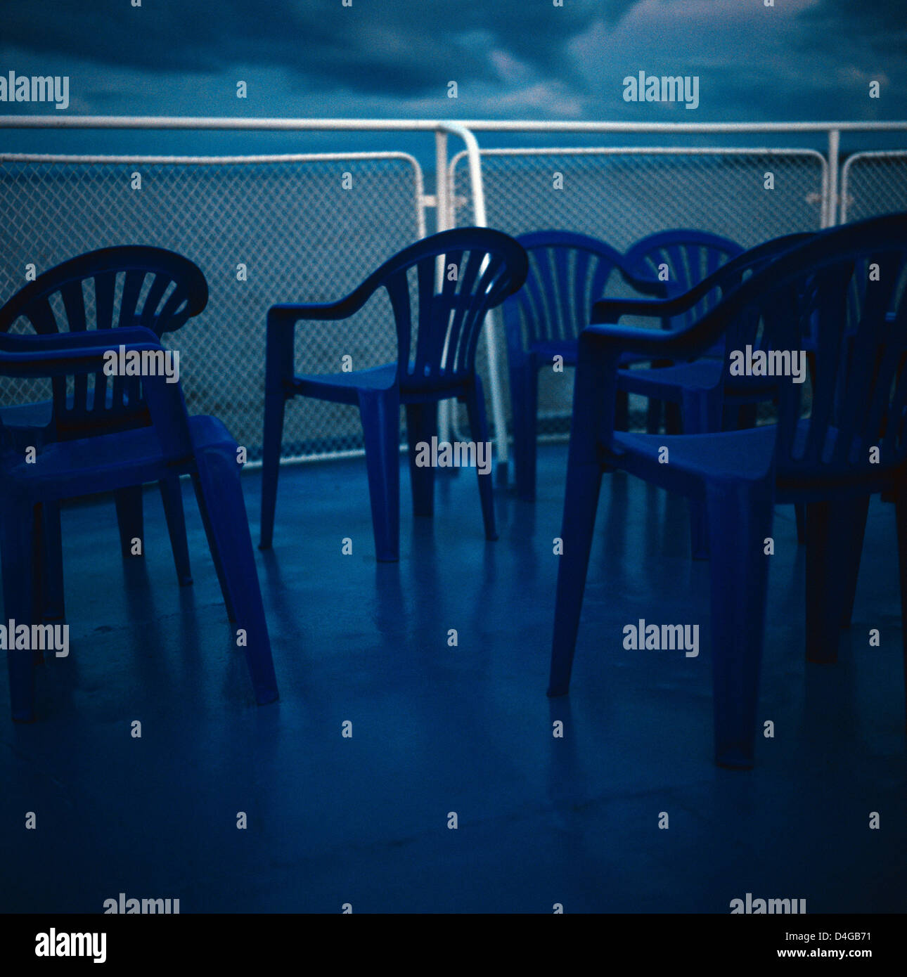 Blue chairs at blue ship deck Stock Photo - Alamy