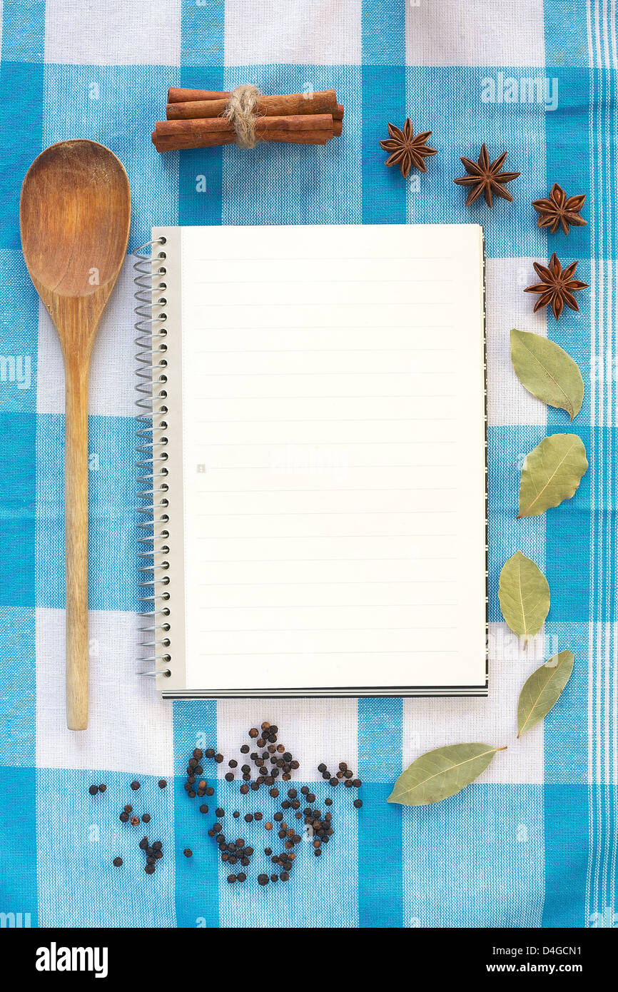 Blank notebook with spices and a wooden spoon Stock Photo - Alamy