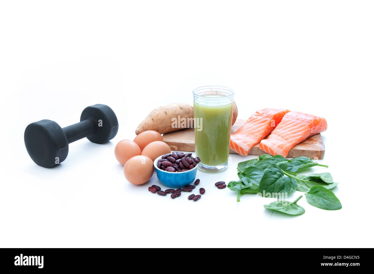 Dumbbell and protein rich foods Stock Photo - Alamy