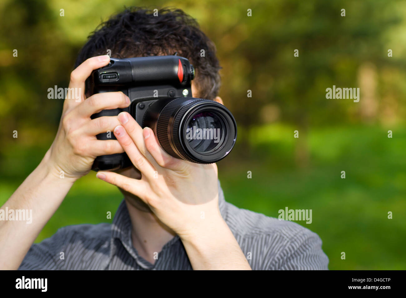 Sneaky photographer getting his shot of nature Stock Photo - Alamy