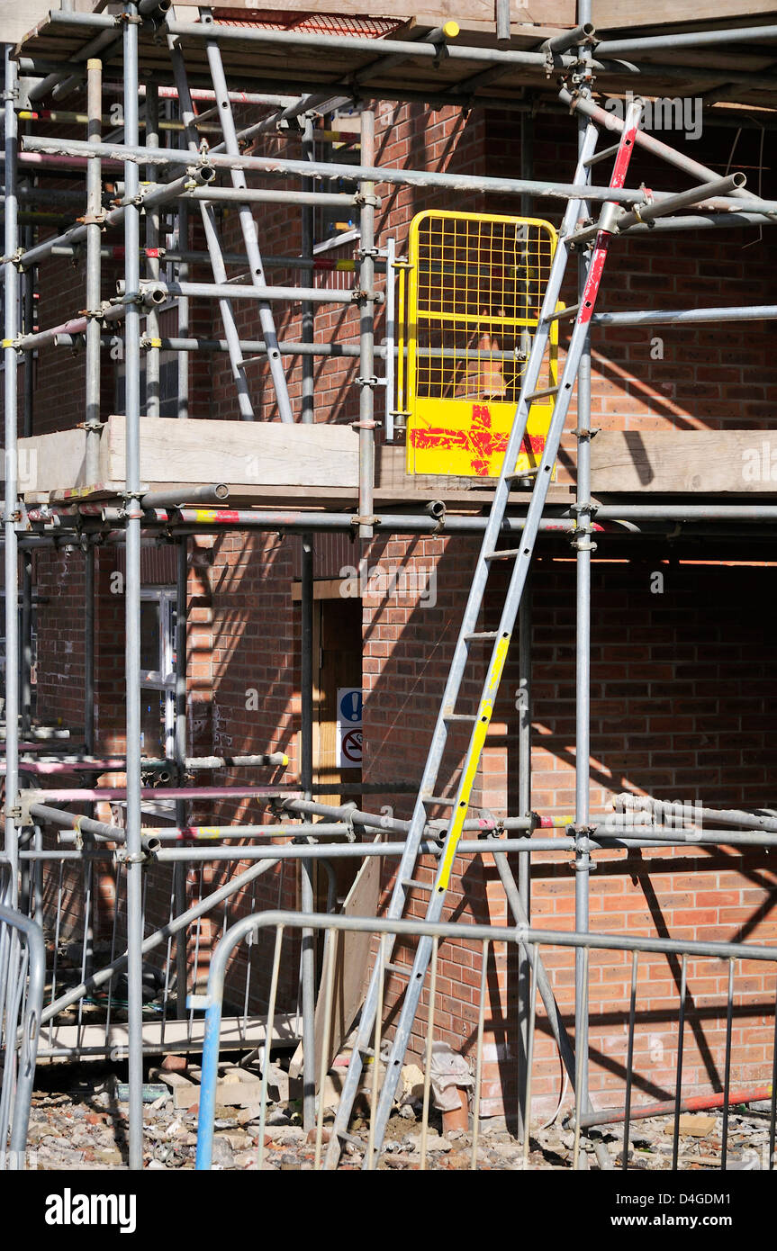 Scaffolding surrounding a new building Stock Photo - Alamy