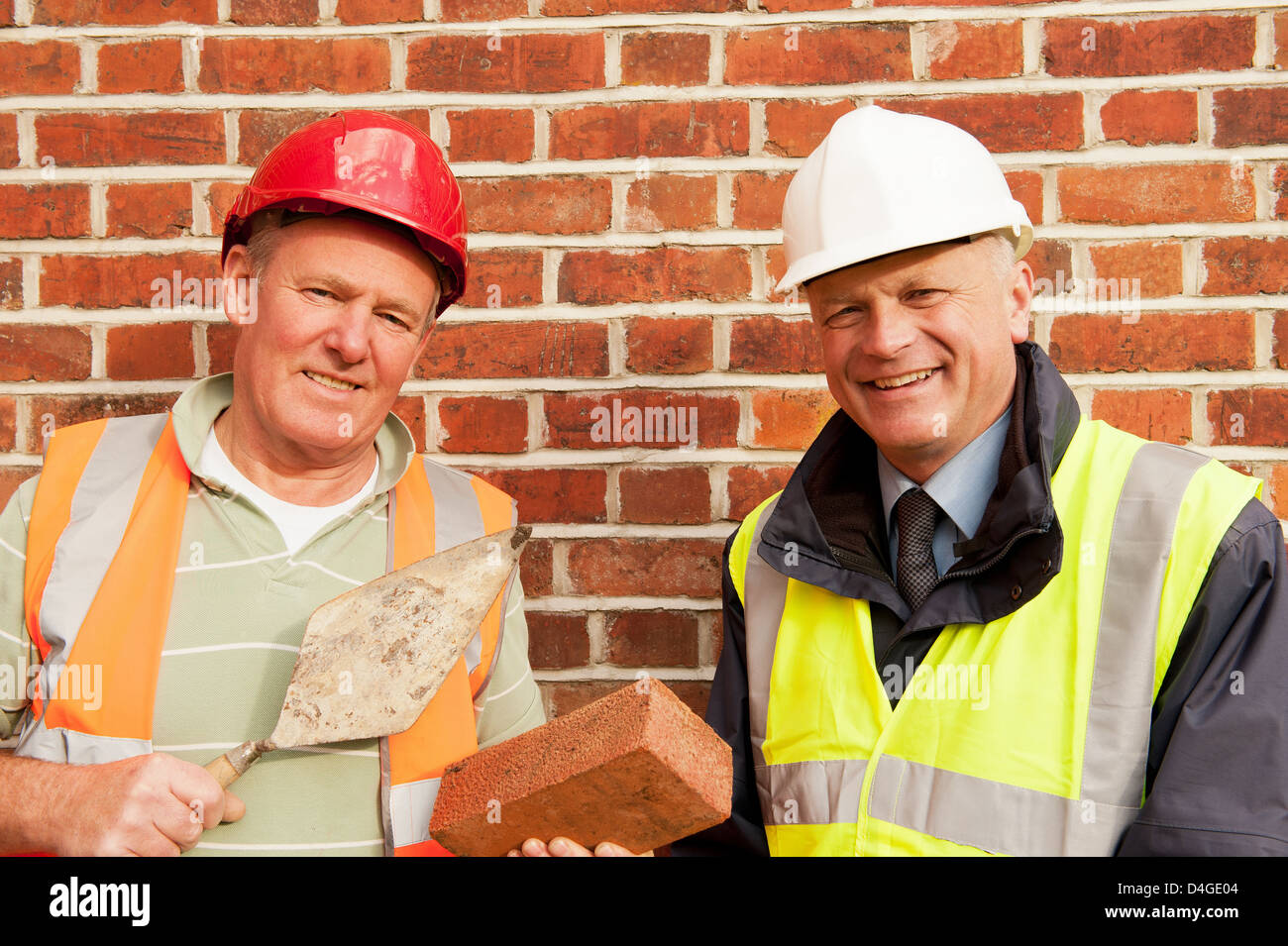 Smiling bricklayer holding trowel hi-res stock photography and images ...