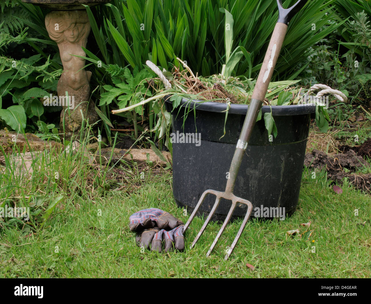 A break from weeding in the garden Stock Photo - Alamy