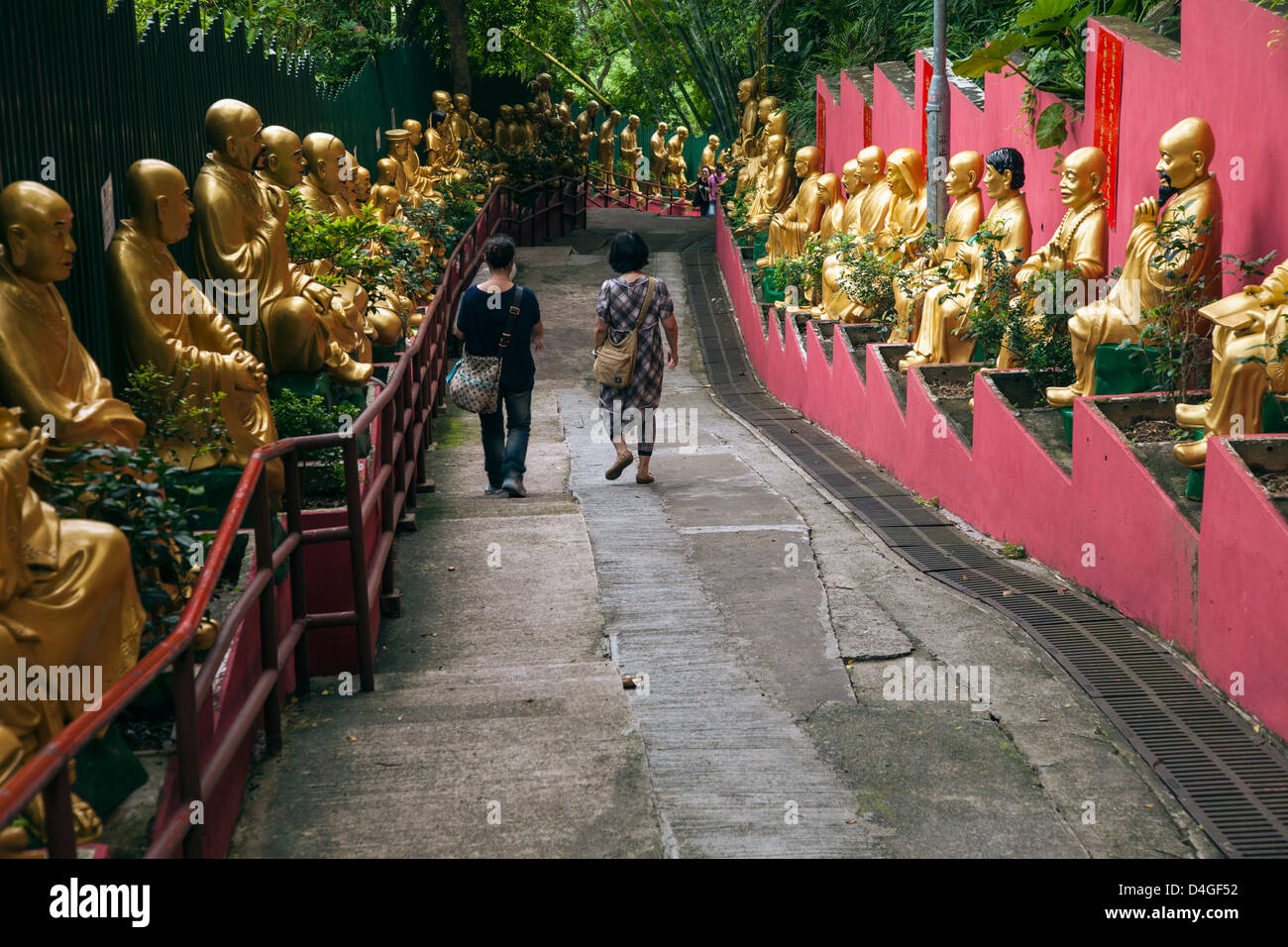 A couple walking down the stairs at 10,000 Buddhas Monastery, New ...