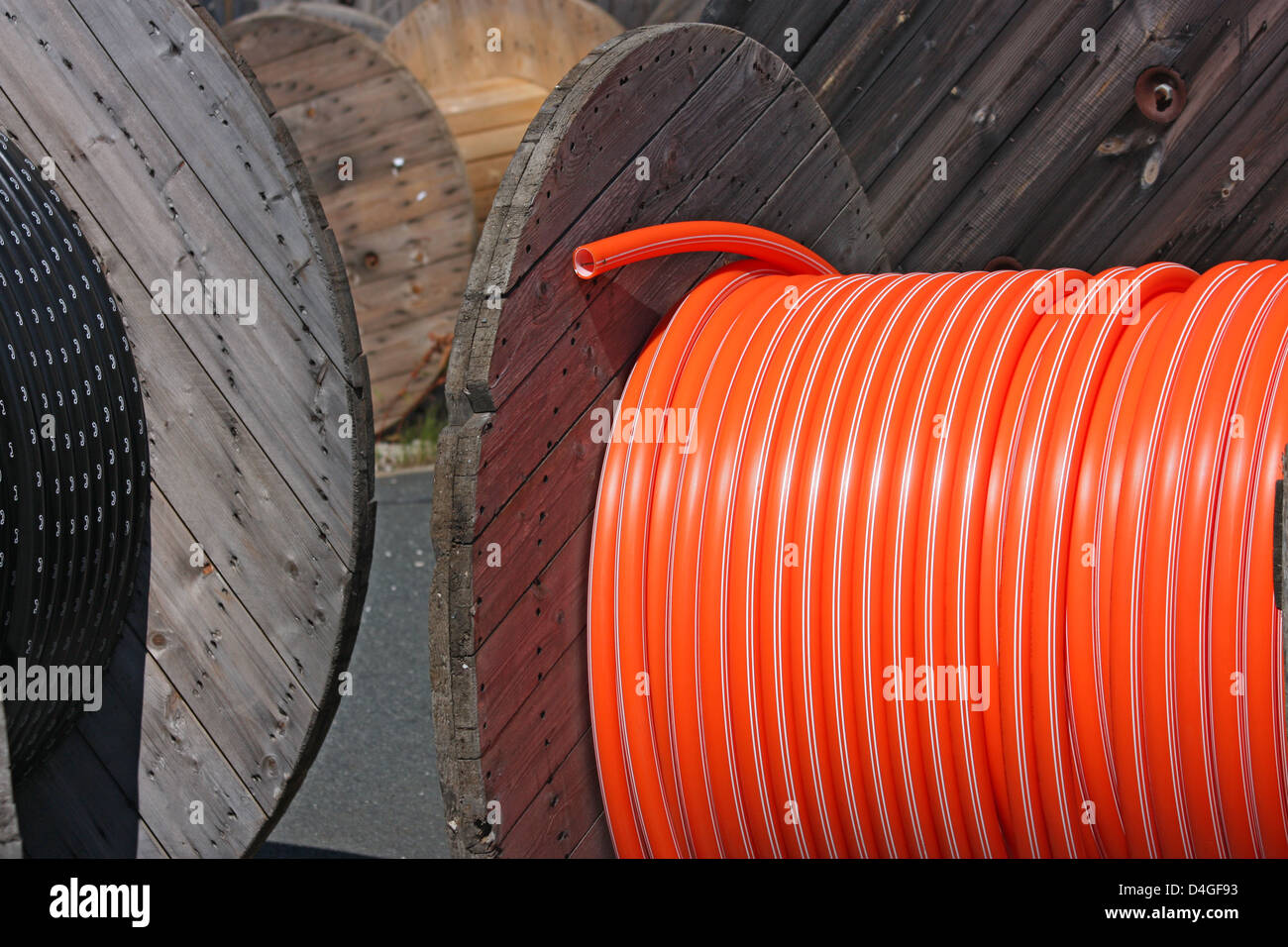 plastic tube on wooden spool Stock Photo - Alamy