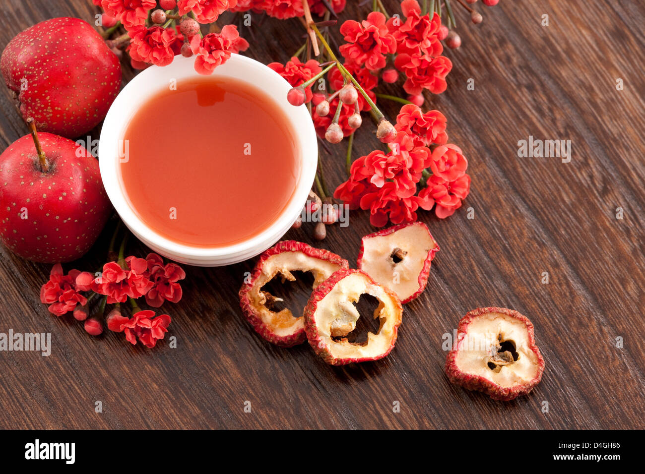 Hawthorn and hawthorn juice with wintersweet flower Stock Photo - Alamy