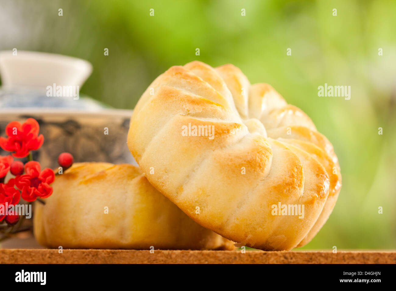 Chinese traditional dessert and tea with decorative wintersweet flower ...