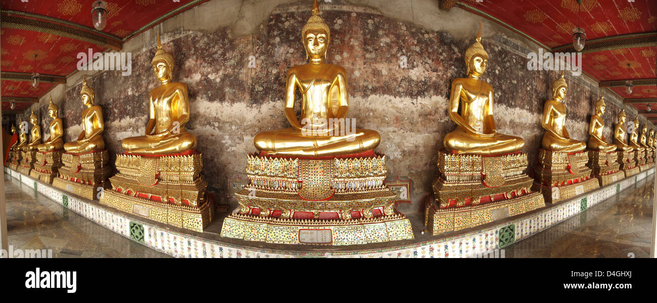 Row of Buddha statues at Wat Suthat temple in Bangkok , Thailand Stock ...