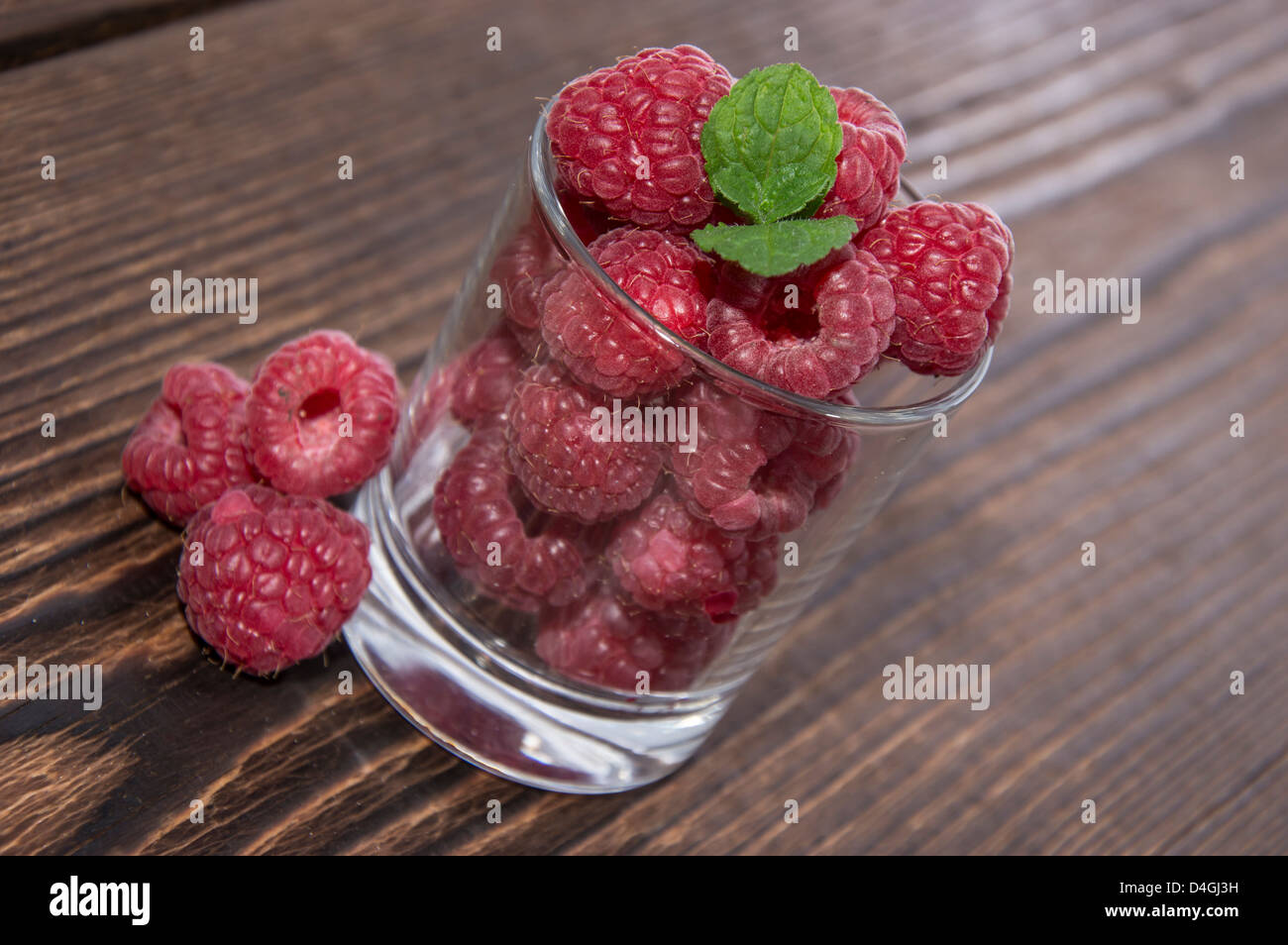 Portion of fresh Raspberries in a glass Stock Photo - Alamy