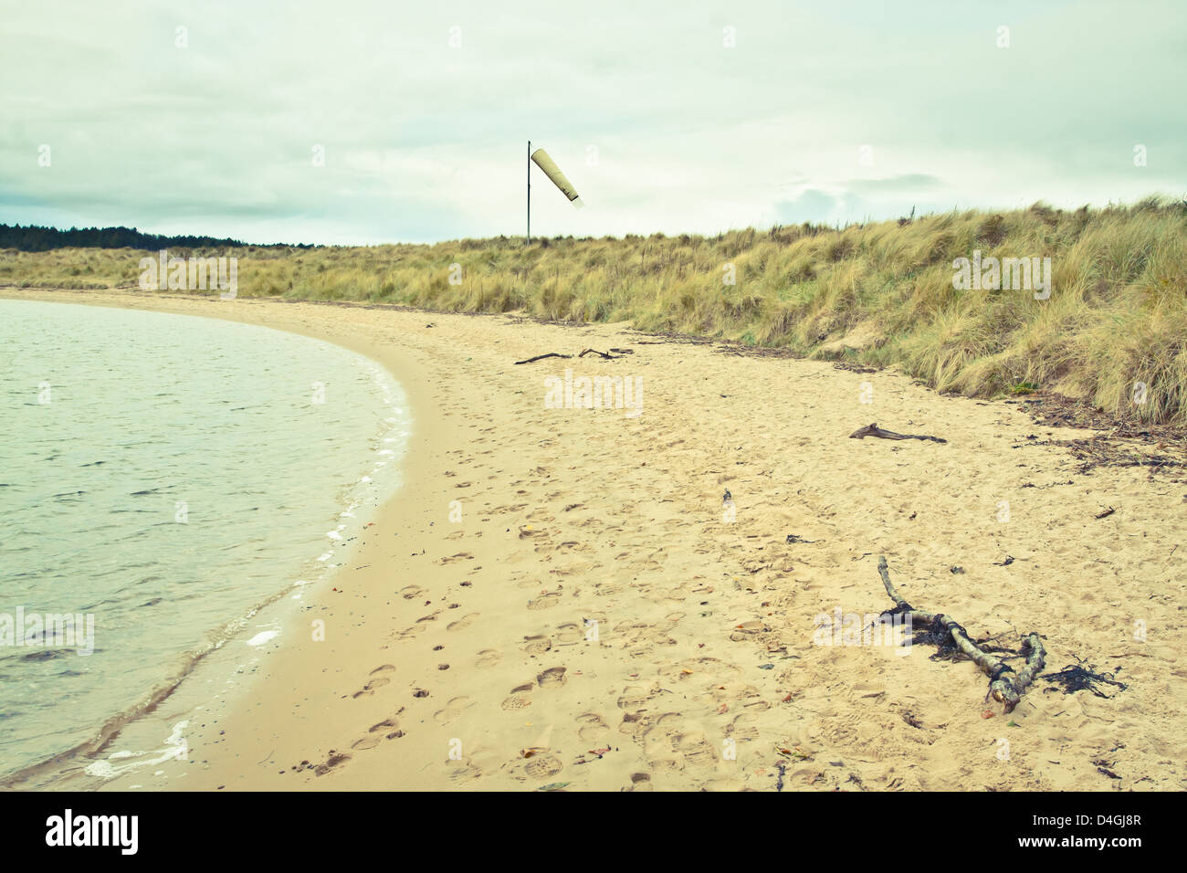 Toned image of a beach in Scotland with a windsock Stock Photo - Alamy
