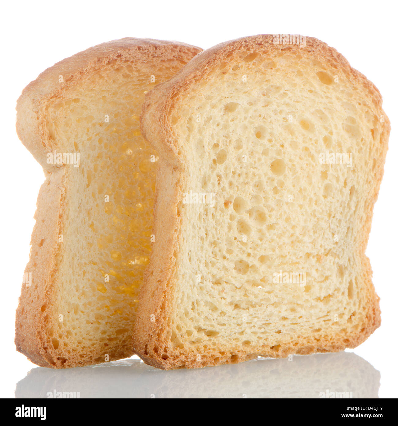 Two pieces of golden brown toast on white background Stock Photo - Alamy