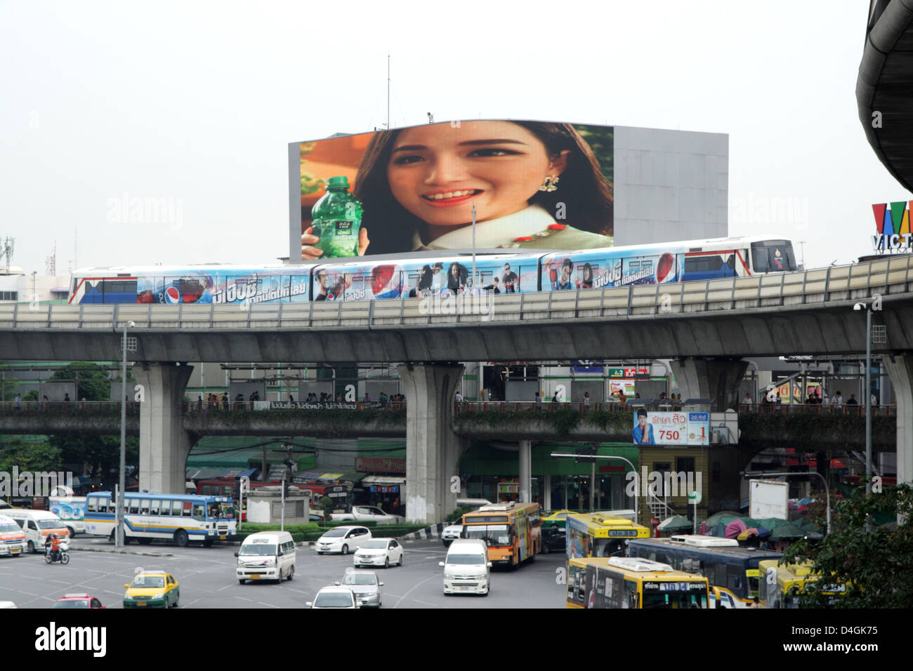 BTS sky train over traffic at Victory Monument in Bangkok , Thailand ...