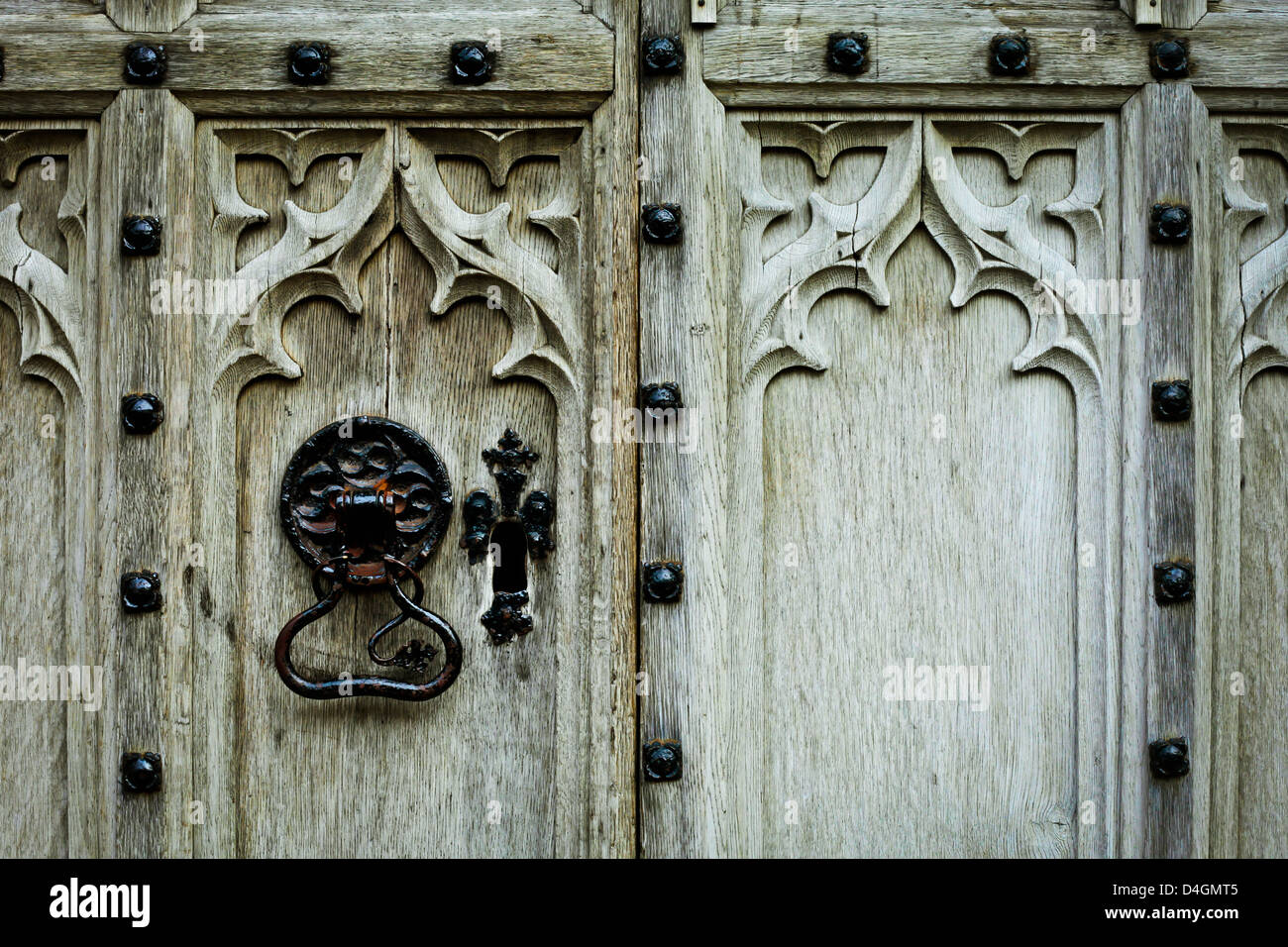 Metal door handle on a medieval wooden door Stock Photo - Alamy