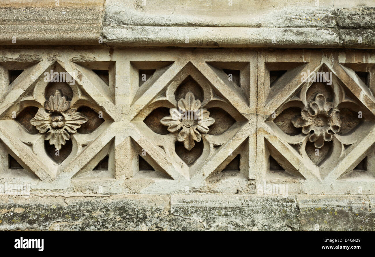 Medieval design in a stone church wall Stock Photo - Alamy