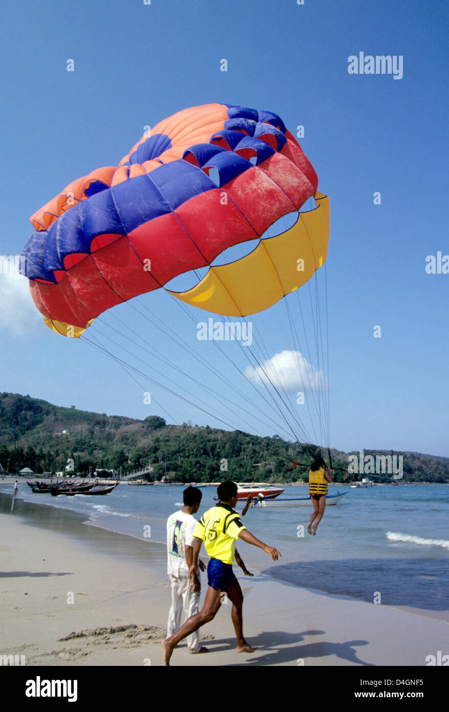 parasailer takes off from Phuket Thailand beach Stock Photo - Alamy