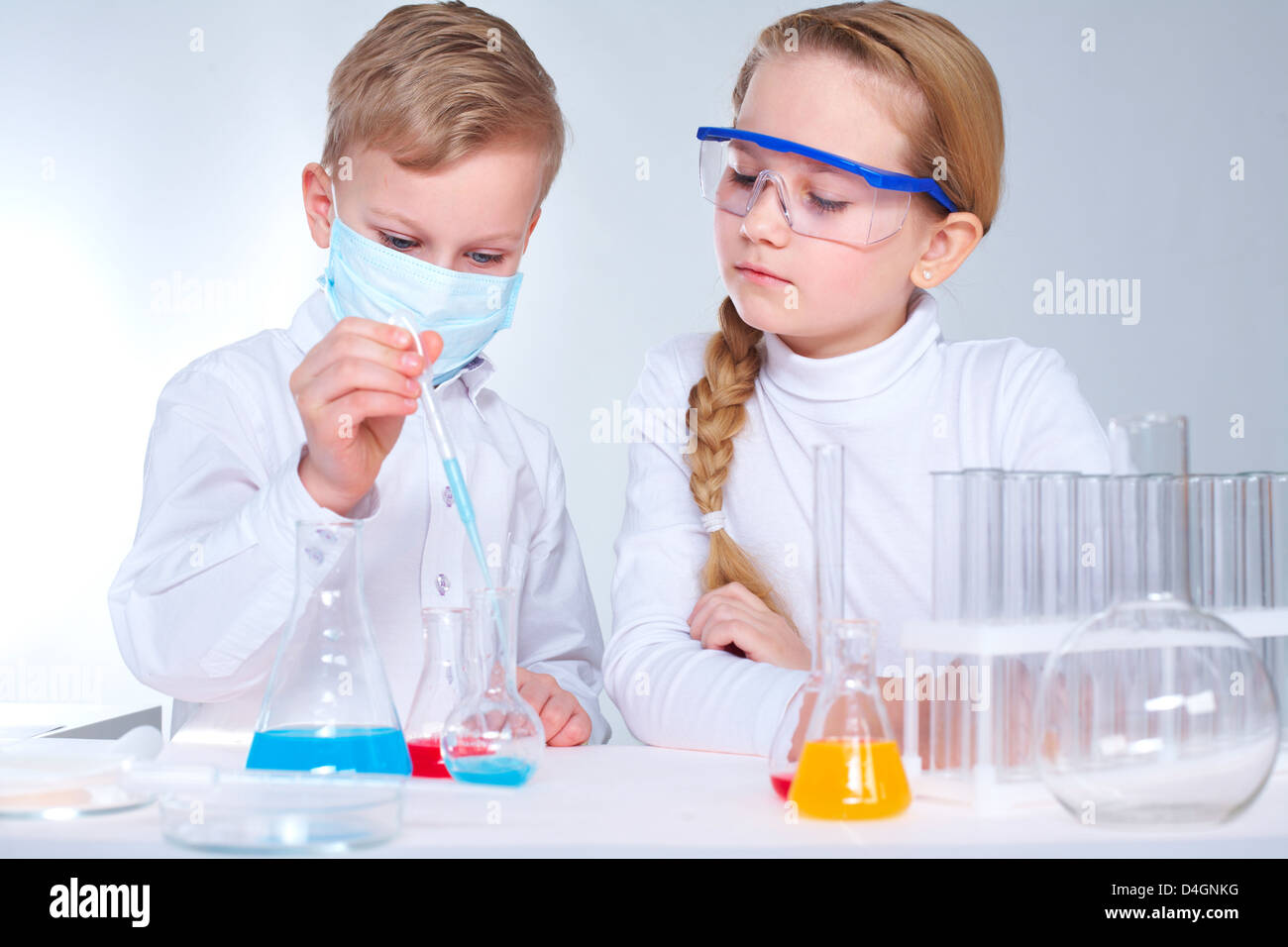 Two children making chemical experiments Stock Photo - Alamy