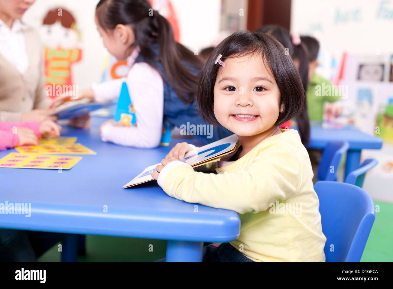Cute girl with flash cards Stock Photo - Alamy