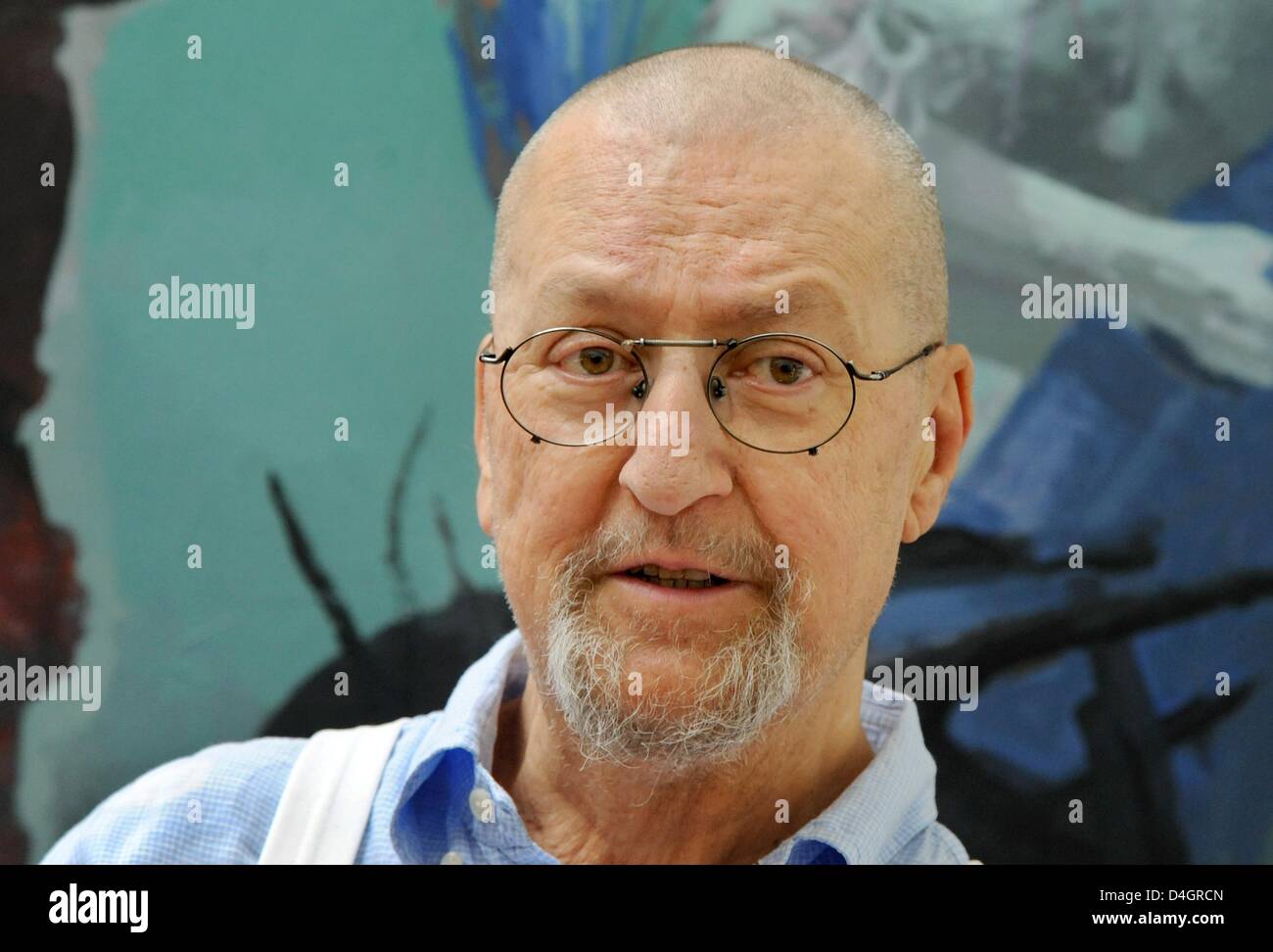 Painter Arno Rink sits in front of his new work 'Jagd' ('Hunt') in his ...