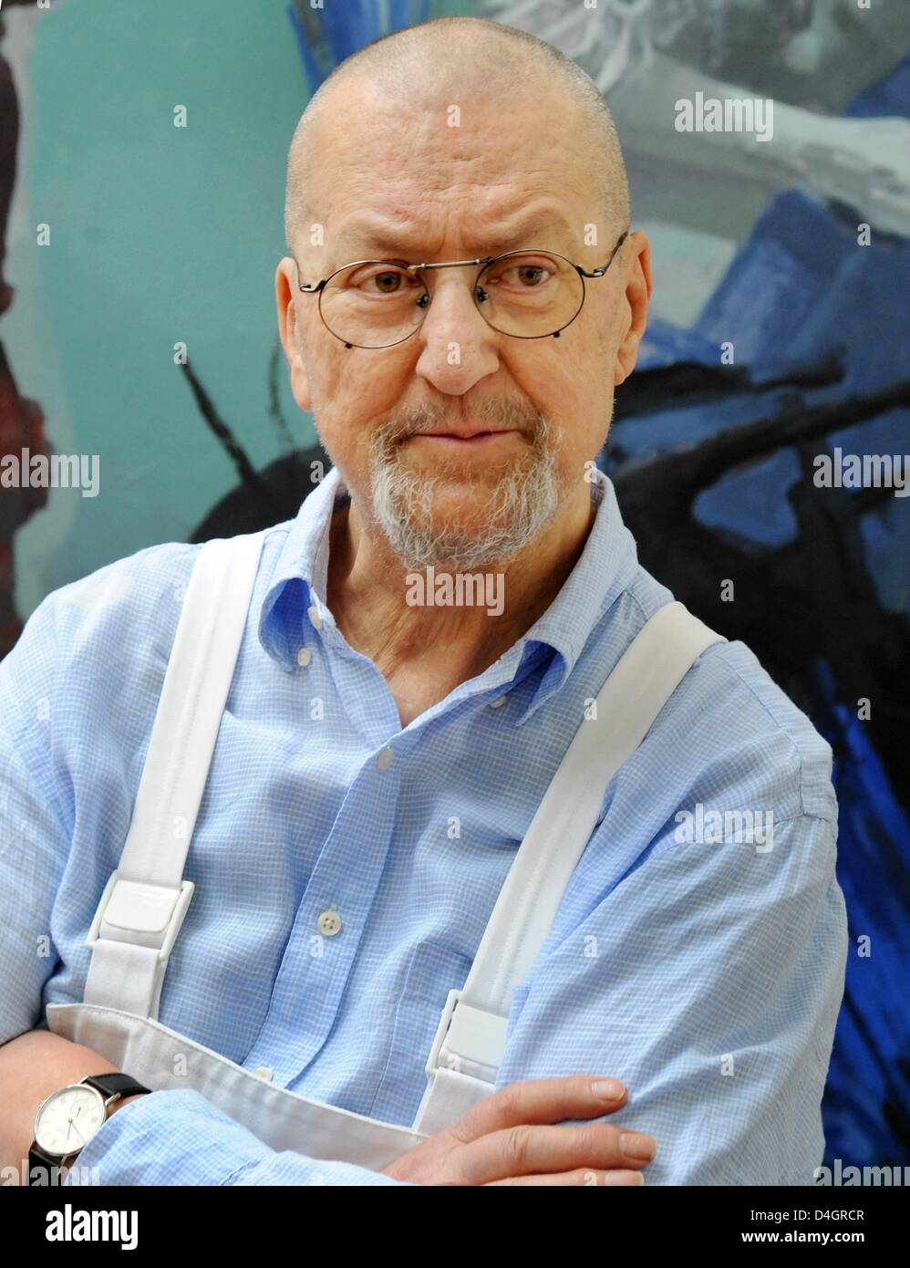 Painter Arno Rink sits in front of his new work 'Jagd' ('Hunt') in his ...