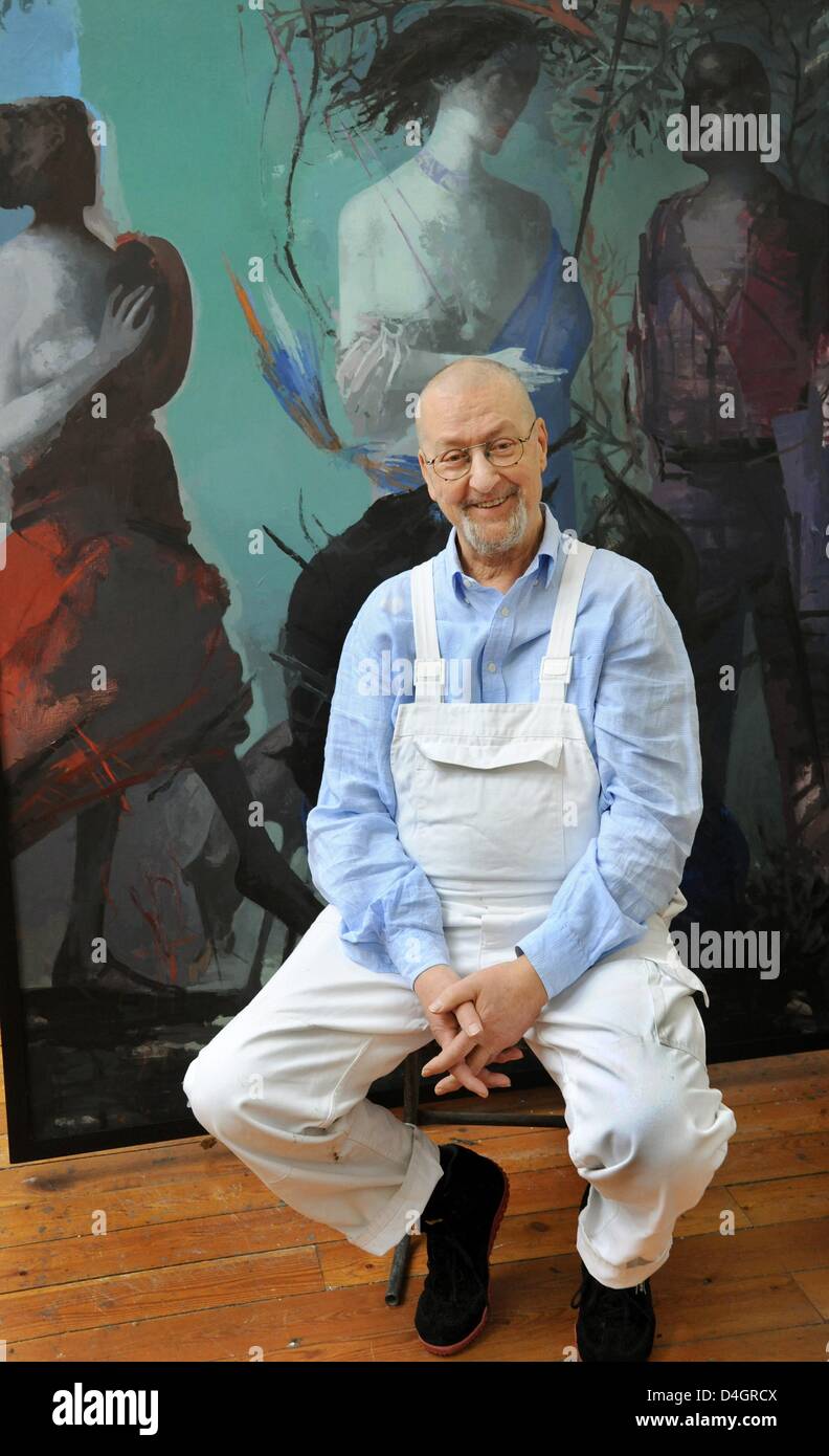 Painter Arno Rink sits in front of his new work 'Jagd' ('Hunt') in his ...