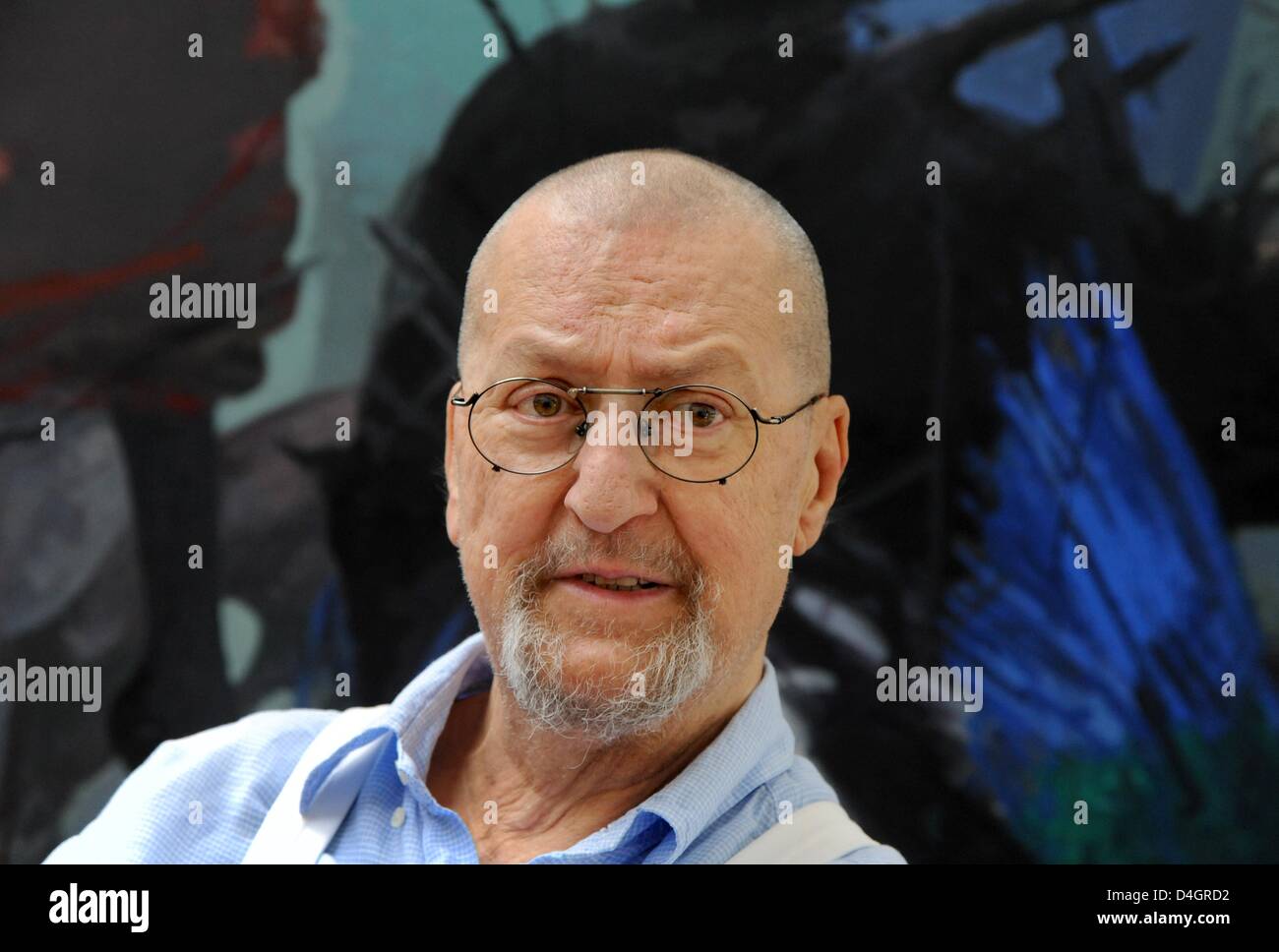 Painter Arno Rink sits in front of his new work 'Jagd' ('Hunt') in his ...