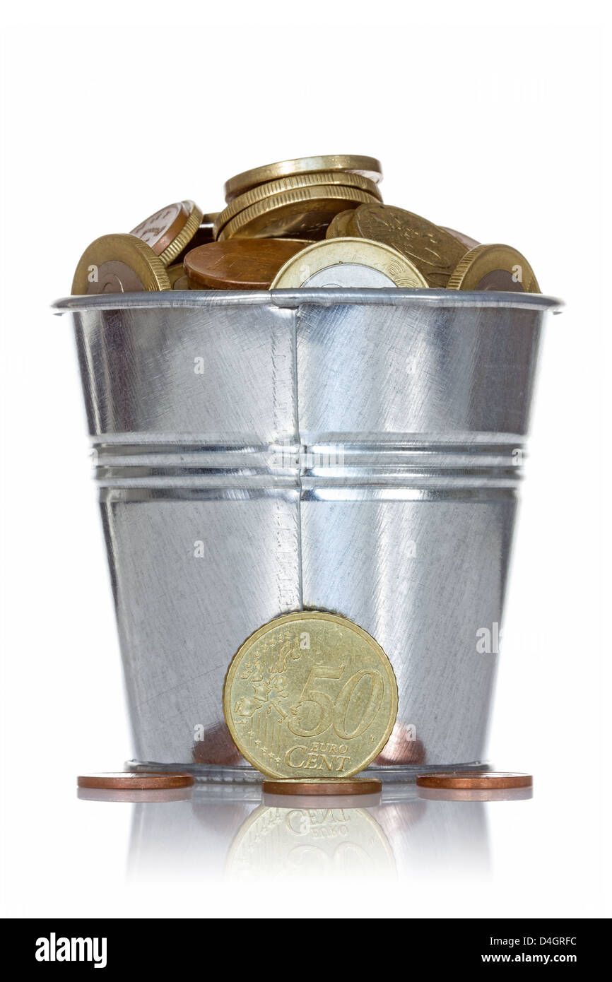Full bucket of coins on white background Stock Photo - Alamy