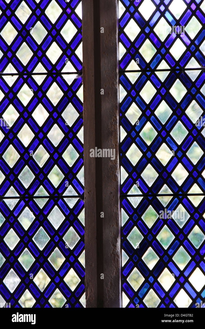A church window with stained glass blue diamond shapes Stock Photo - Alamy