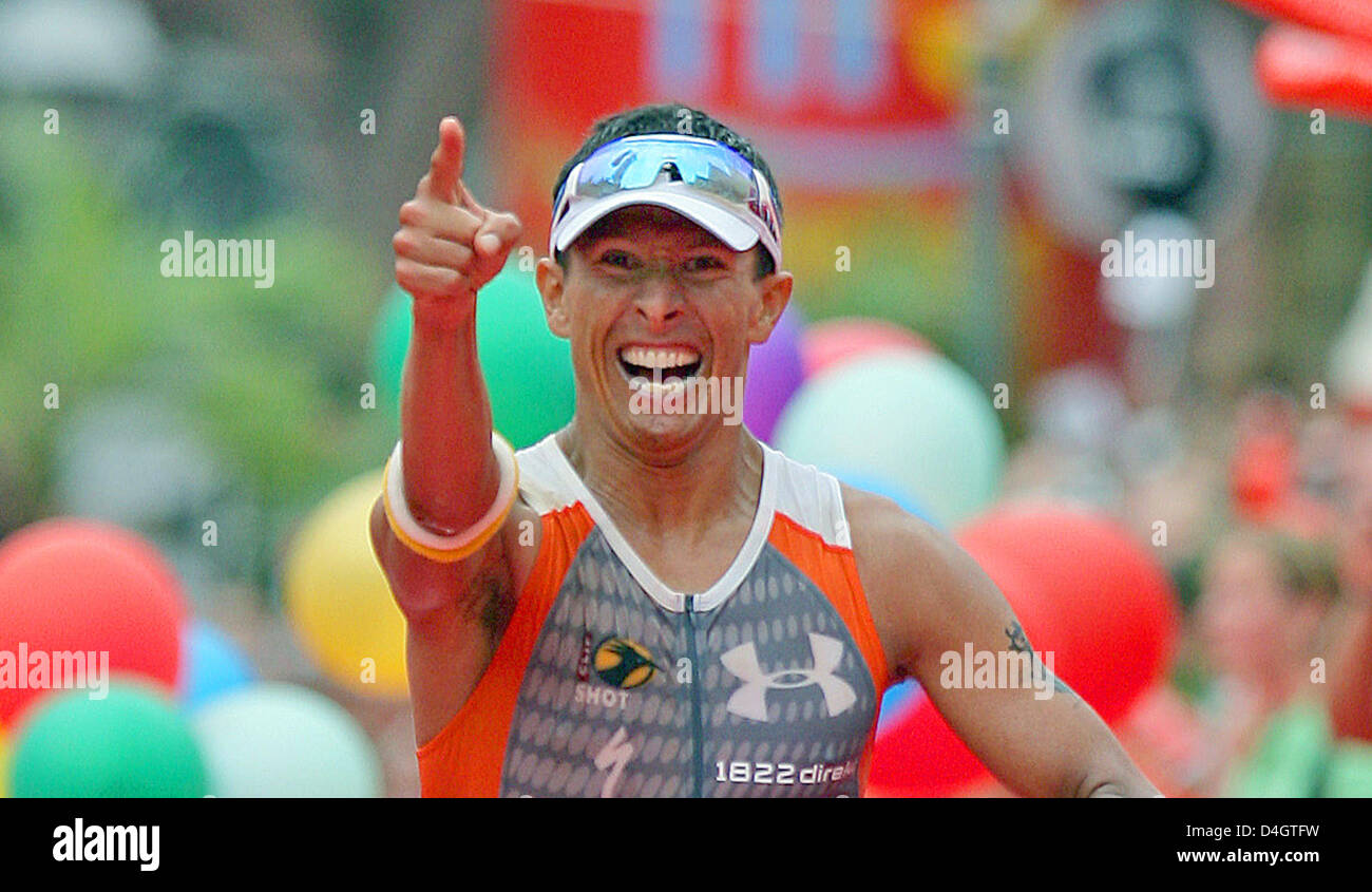 Australian Chris McCormack cheers after winning the Ironman Germany in ...