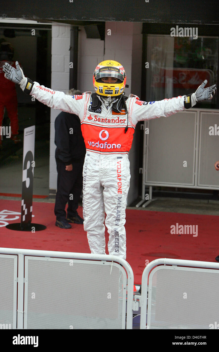 British Formula One driver Lewis Hamilton of McLaren Mercedes greets ...