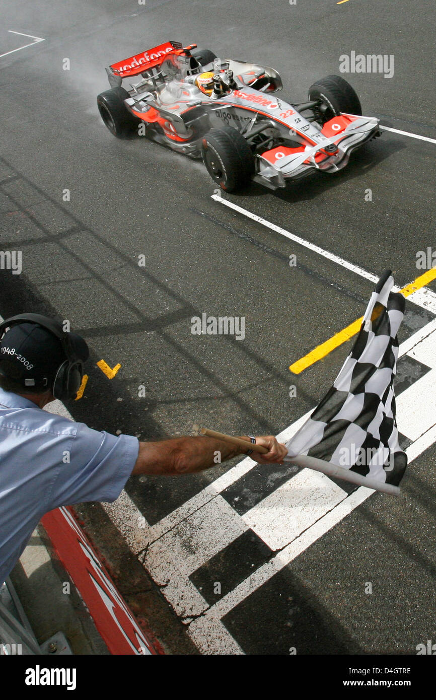 British Formula One driver Lewis Hamilton of McLaren Mercedes crosses ...