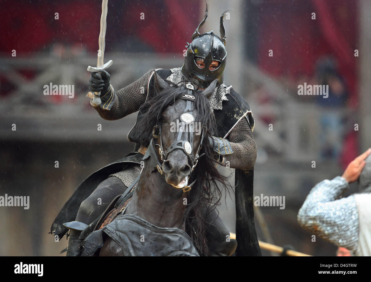 The 'Black Knight' rides his horse at the arena of Kaltenberg's Knights ...